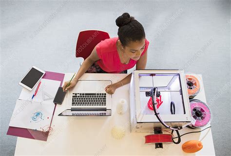Female Designer At Laptop Watching 3d Printer Stock Image F0216401