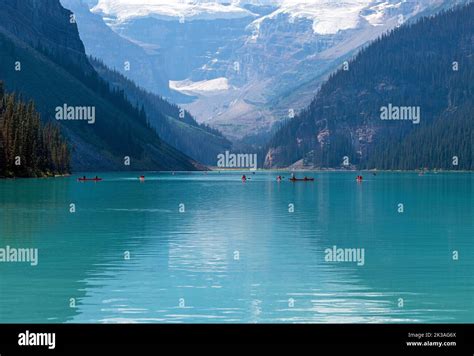 Lake Louise With People Kayaking And Victoria Glacier Reflection Banff
