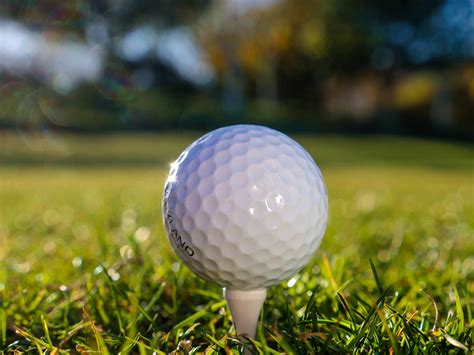 Download 4k Close Up Photo Of Golf Ball Wallpaper