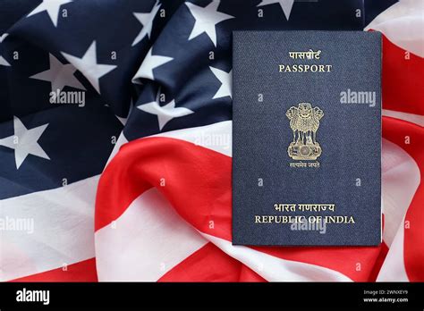 Blue Indian Passport On United States National Flag Background Close Up