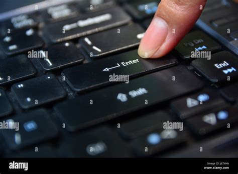 Finger Pushing Enter Button On Keyboard Finger Pressing A Keyboard Button Stock Photo Alamy