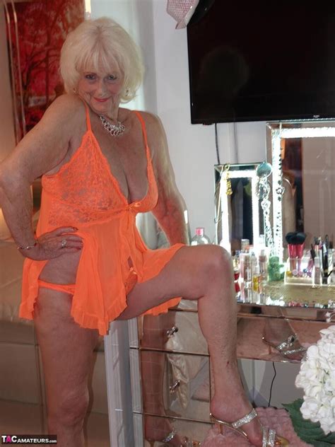 Blonde Granny Sparkle Finger Spreads Her Pussy On A Bed In Lingerie