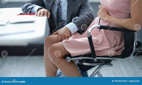 Man In Suit Stroking Knee Of Woman Secretary At Work Closeup Stock