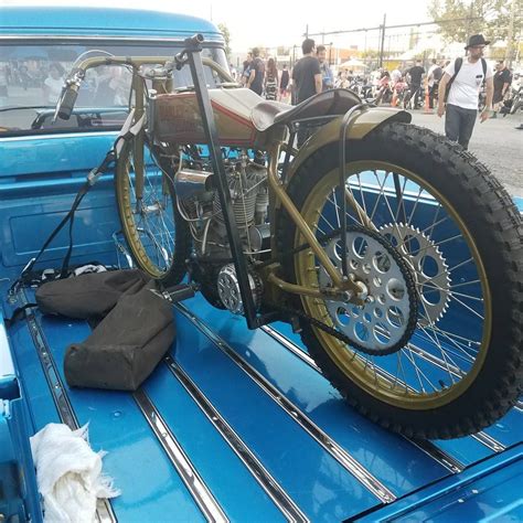 Antique Harley Davidson Motorcycle On Blue Pickup Truck