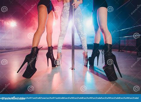 Young Striptease Dancers Moving In High Heels Shoes On Stage In Strip Night Club Pole Dancing