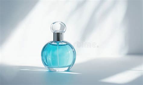 Elegant Blue Perfume Bottle With Round Design And Silver Cap