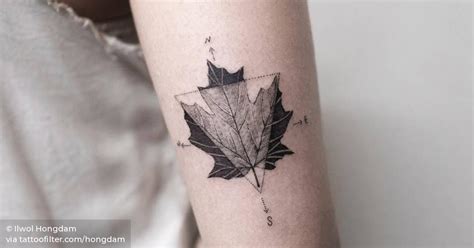 Maple Leaf And Compass Tattoo On The Back Of The Right