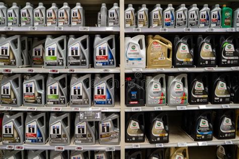 Motor Oil Containers Of Mobil 1 And Castrol Brands On Store Shelf