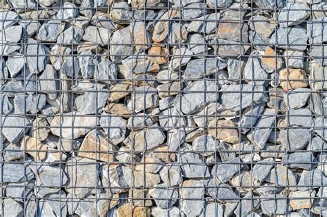 Premium Photo A Stone Fence In A Wire Frame Background With Copy Space