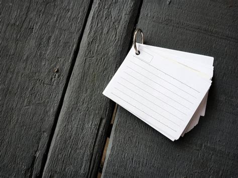 Premium Photo High Angle View Of Paper Hanging On Table