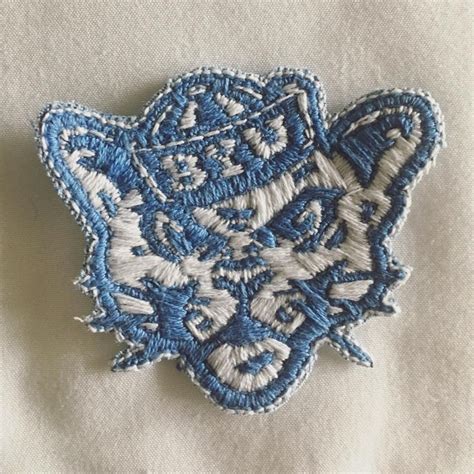 A Blue And White Piece Of Cloth With An Intricate Design On Its Side