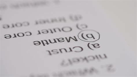 Female Circles Correct Answers In Standard Exam Test Paper With Black Pen Student Filling Up Female Circles Correct Answers In Standard Exam Test Paper With Black Pen Student Filling Up