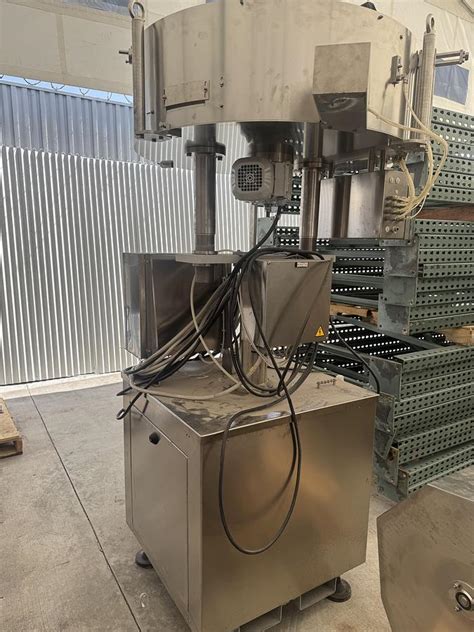 Used Arol Capper With Hopper And Elevator For Sale At Star Industries