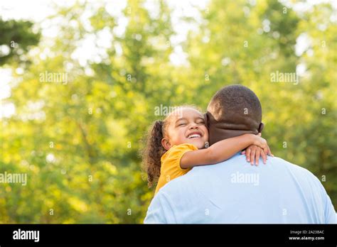 Father Laughing And Playing With His Daugher Stock Photo Alamy