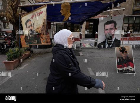 Shoes Hanging In Front Of Portraits Of Ousted Syrian President Bashar