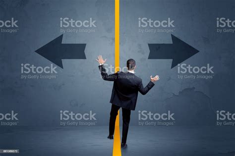 Business Person Choosing Between Two Options Separated By A Yellow