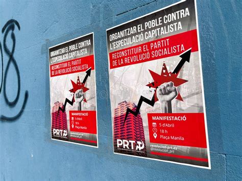 Political Posters Promoting Anti Capitalist Sentiments On A Blue Wall