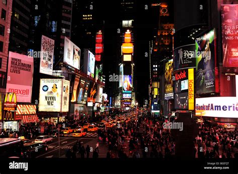 Neon Signs And Yellow Taxi Cabs Light Up Times Square In New York Usa