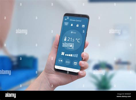 Modern Climate Control App Interface On A Smartphone In Hand Concept