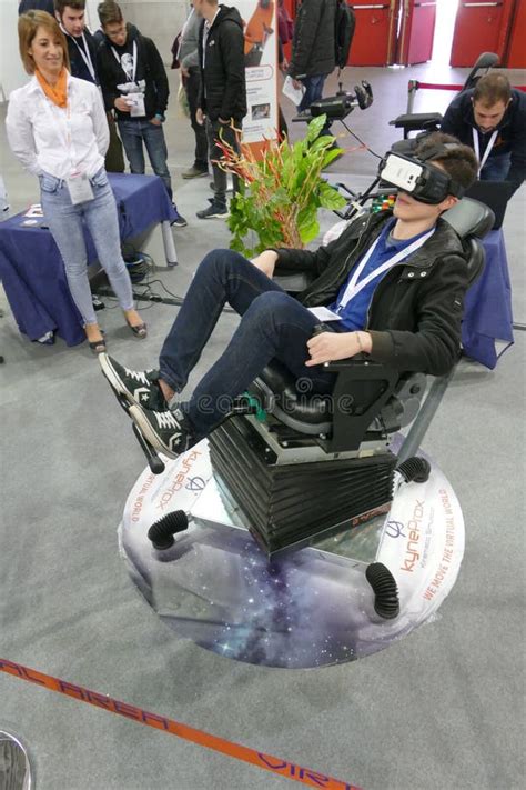 teen wearing virtual reality device testing flight simulator editorial