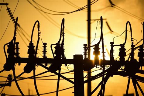 Premium Photo Low Angle View Of Silhouette People Walking On Cable