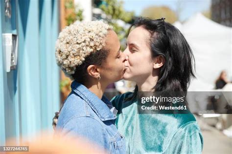 Interracial Lesbian Couple Kissing Photos And Premium High Res Pictures