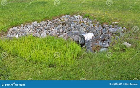 Storm Culvert Surrounded By Rocks And Grass Stock Image Image Of Pipe