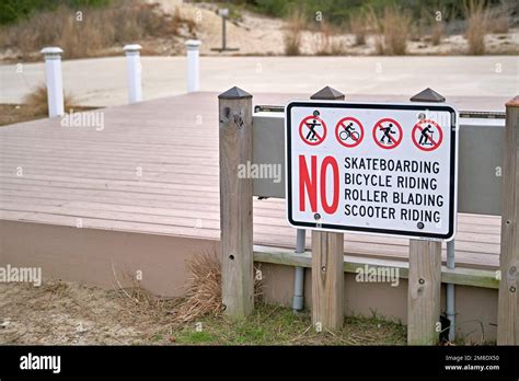 A Sign Informs The Public Of No Skateboarding Bicycle Riding Roller Blading Or Scooter Riding