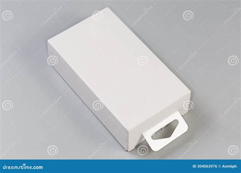 White Rectangular Cardboard Hang Tab Packing Box On Gray Surface Stock