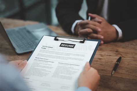 Person Submitting Resume To Interview For A Job With A Company Person