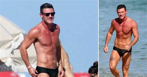 Luke Evans Shows Off Chiseled Body A Tiny Speedo While Working On His