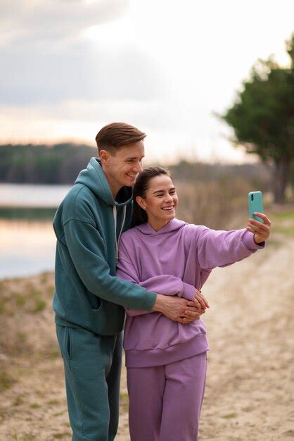 Free Photo Medium Shot Couple Taking Selfie