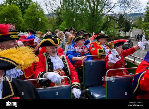 Town Criers Smile Bellmen And Bellwomen In Colourful Braided Criers Livery Uniforms Sitting On