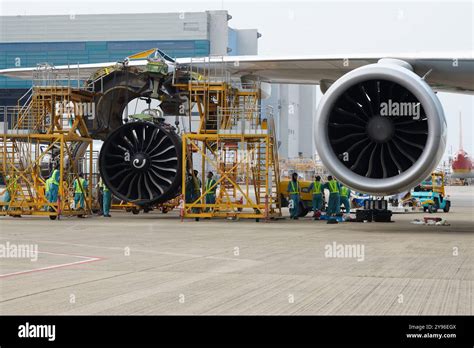 Engineers Repairing An Airbus A350 Passenger Jet Engine After Reported