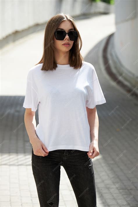 Premium Photo Girl Or Woman Wearing White Blank T Shirt With Space