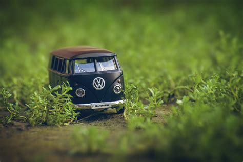 A Miniature Vw Bus Is Sitting In The Grass Photo Free Volkswagen Bus