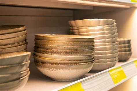 Premium Photo Shelf With Ceramic Plates For Sell In A Tableware Store
