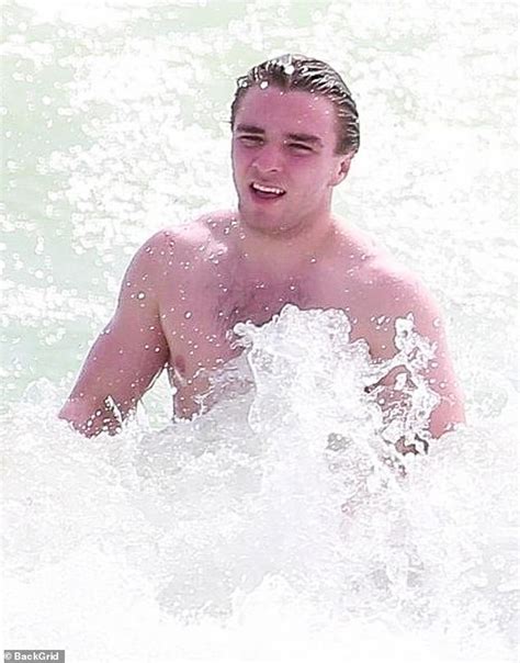 Rocco Ritchie Goes Shirtless As He Performs Headstands On The Beach In