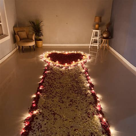Rose Petals On Bed With Candles