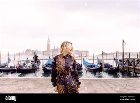 Beautiful Blond Woman In Venice Solo Girl Traveler On Holiday Stock