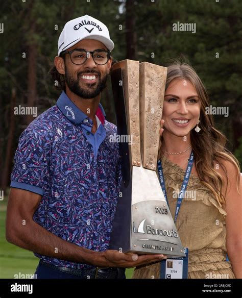 Akshay Bhatia Holds The Championship Trophy With Girlfriend Presleigh