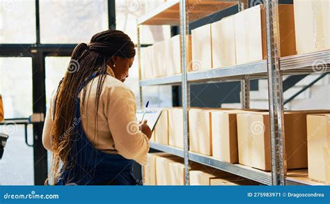 Young Worker Scanning Barcodes On Packs Of Supplies Stock Image Image