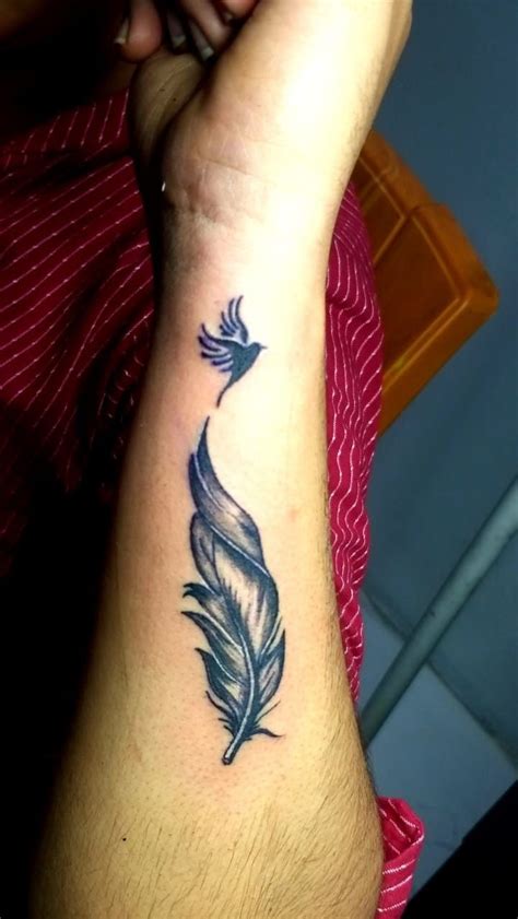 Wrist Female Feather Tattoo Designs