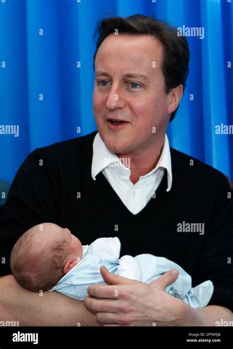 Britains Conservative Party Leader David Cameron Holds Three Days Old