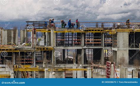 Monolithic Frame Construction Of The Building Workers Working At The Construction Site At Home