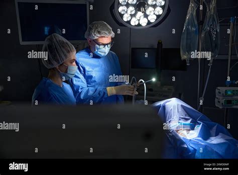 Doctors During Gynecological Surgery Operation Using Laparoscopic