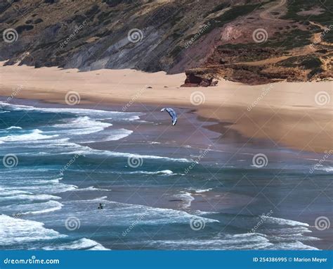 Core Kite Surfer And Umbrella In Wild Waves At The Ocean Editorial