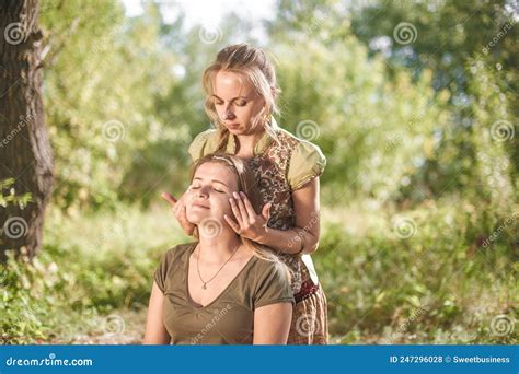 Massage Professional Performs A Relaxing Massage On The Forest Floor