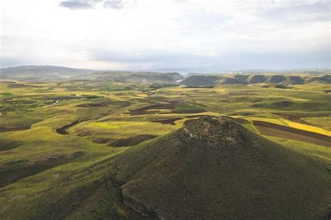 Premium Photo Green Plateau With Small Volcanoes And Calders During Spring
