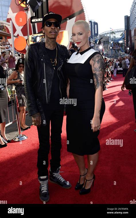 Rapper Wiz Khalifa Left And His Girlfriend Amber Rose Arrive At The